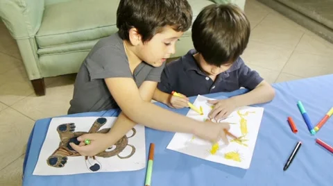 Boys Helping with Coloring Drawing (HD) | Stock Video | Pond5