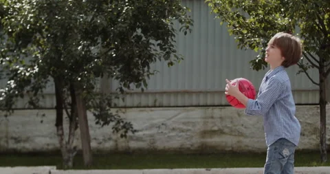 Boys play ball outside in summer. Media.... | Stock Video | Pond5