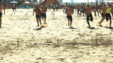 boy's surf life saving beach flags race | Stock Video | Pond5