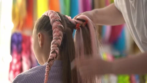 Braiding of kanekalon braids for a girl ... | Stock Video | Pond5