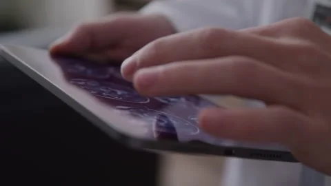 Brain Surgeon Holding a Tablet as He Loo... | Stock Video | Pond5