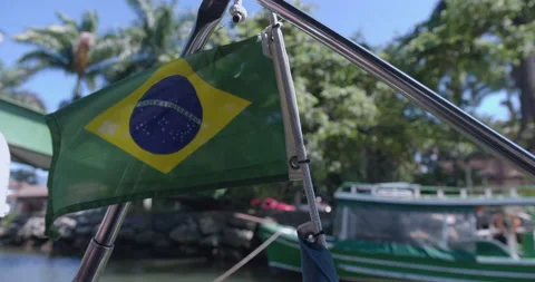 Brazilian flag on boat flies in wind as ... | Stock Video | Pond5