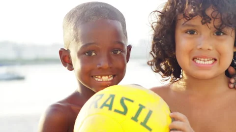 Brazilian kids pose with a soccer ball o... | Stock Video | Pond5