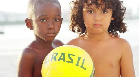 Brazilian kids pose with a soccer ball o... | Stock Video | Pond5