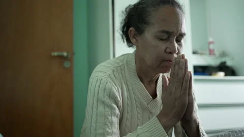 Brazilian older woman praying to God. Fa... | Stock Video | Pond5
