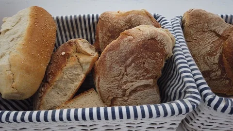 Bread and pastries in baskets on the tab... | Stock Video | Pond5