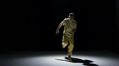 Breakdance dancer in yellow suit starts ... | Stock Video | Pond5