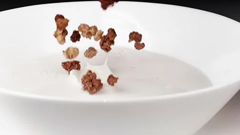 breakfast cereal falling down on fresh w... | Stock Video | Pond5