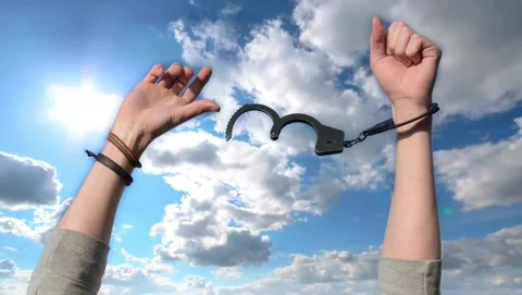 Breaking free for freedom from handcuffs... | Stock Video | Pond5