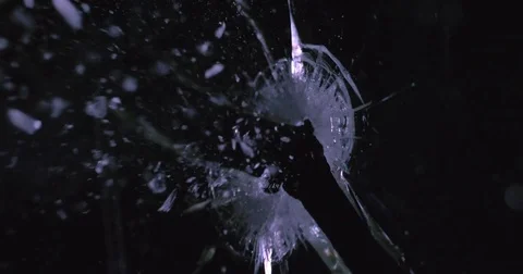 Breaking glass with bullet shot at 1000f... | Stock Video | Pond5