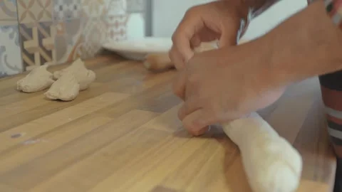 Breaking homemade Roti into dough balls | Stock Video | Pond5