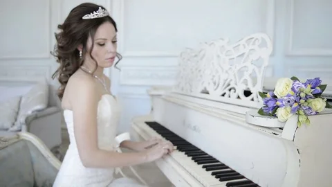 Bride playing the piano in a white vinta... | Stock Video | Pond5