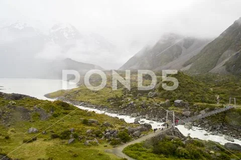 An bridge across a river in Mount Cook Nat Park, NZ. Hooker Valley ...