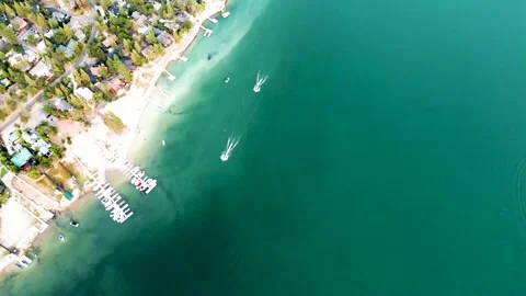Bright lake overview. Beach with boats d... | Stock Video | Pond5