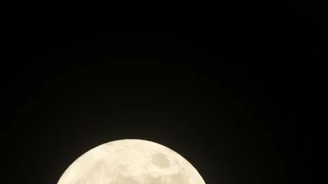 Bright Moving Full Moon in black backgro... | Stock Video | Pond5