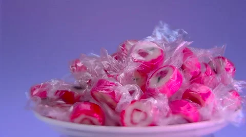 Bright pink candy in a transparent wrapp... | Stock Video | Pond5