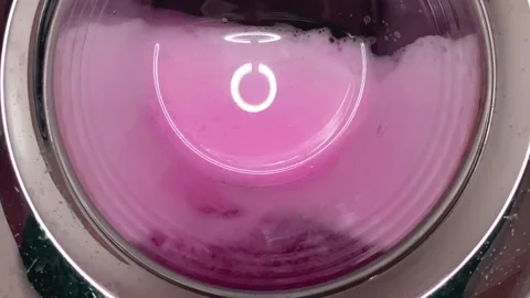Bright pink foam in the washing machine ... | Stock Video | Pond5