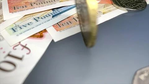 British 2 pounds coin spinning in slow m... | Stock Video | Pond5