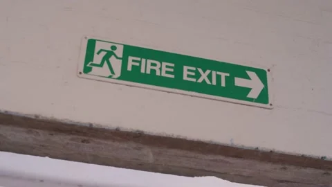 British Green Fire Exit Sign Above Door ... | Stock Video | Pond5