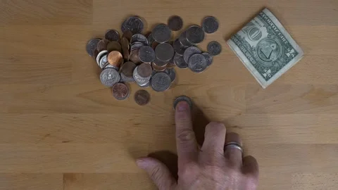 A broke man counting change | Stock Video | Pond5