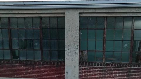 Broken glass windows in worn out factory... | Stock Video | Pond5