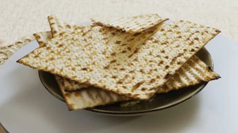 Broken matzah on a plate on the table ro... | Stock Video | Pond5