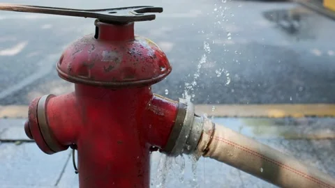 Broken red fire hydrant that is squirtin... | Stock Video | Pond5