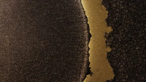 Bronze dust particles fly in slow motion... | Stock Video | Pond5