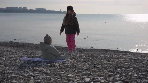 Brother and sister hugging on the beach | Stock Video | Pond5