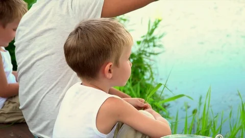 Brothers fishing in the open air. The el... | Stock Video | Pond5