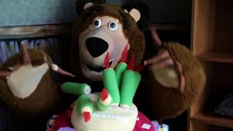 A brown bear life-size puppet sits in a ... | Stock Video | Pond5