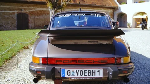 Brown retro Porsche racing car rear view... | Stock Video | Pond5