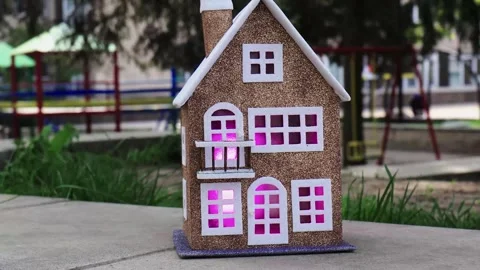 A brown two-story house with a white roo... | Stock Video | Pond5