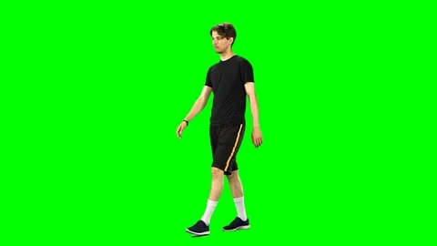Brunette man walking on a Green Screen, ... | Stock Video | Pond5