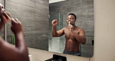 Brushing teeth, dance and black man with... | Stock Video | Pond5