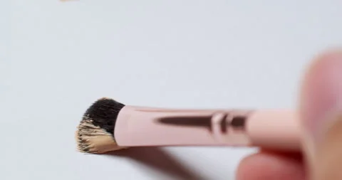 Brushing a wand applicator from left to ... | Stock Video | Pond5