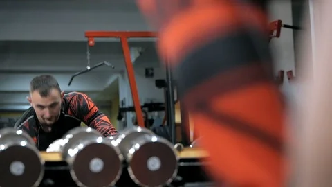 Brutal strong bodybuilder pumping up mus... | Stock Video | Pond5