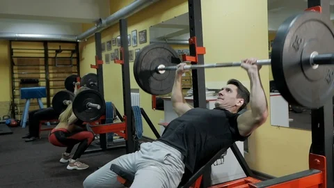 Brutal strong bodybuilder pumping up mus... | Stock Video | Pond5