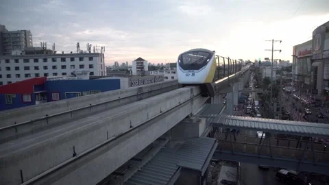 BTS yellow line skytrain above traffic i... | Stock Video | Pond5