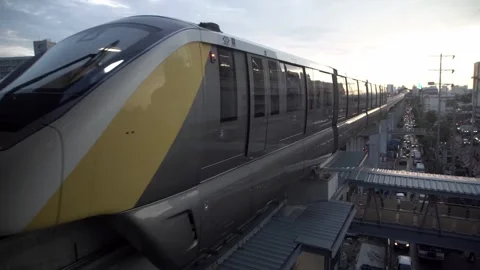 BTS yellow line skytrain above traffic i... | Stock Video | Pond5