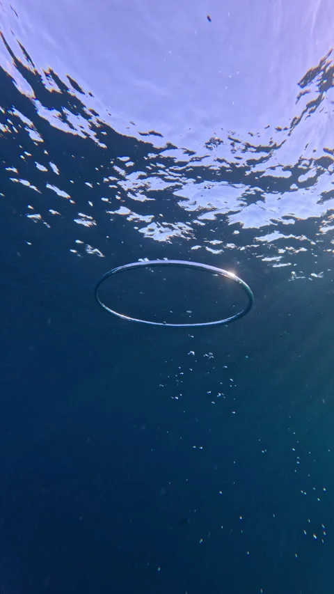 Bubble ring floating underwater in the o... | Stock Video | Pond5