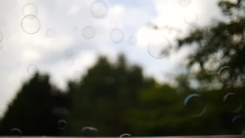Bubbles floating in slow motion rising i... | Stock Video | Pond5