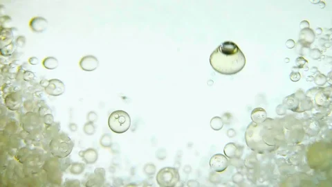 Bubbles of Oil Slowly Rise Up in Water a... | Stock Video | Pond5