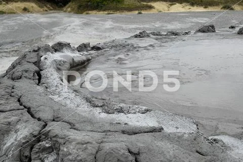 Bubbling crater of a mud volcano. Close up view onto gas bubble ...