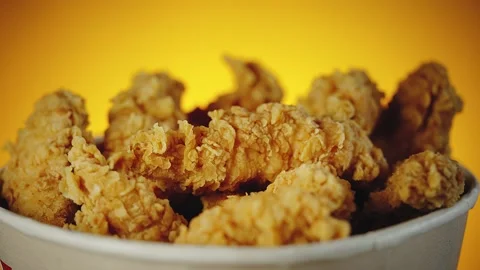 Bucket of crispy golden chicken wings, l... | Stock Video | Pond5