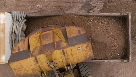 Bucket loader loading soil onto a truck ... | Stock Video | Pond5