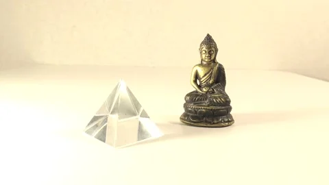 Buddha Statue and Crystal Pyramid on a W... | Stock Video | Pond5