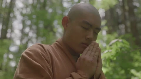 Buddhist Monk with Eyes Closed and Hands... | Stock Video | Pond5