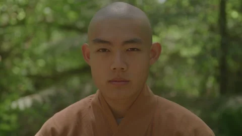 Buddhist Monk Opens His Eyes Outside Dur... | Stock Video | Pond5