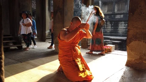 Buddhist monk praying holding a Smoking ... | Stock Video | Pond5